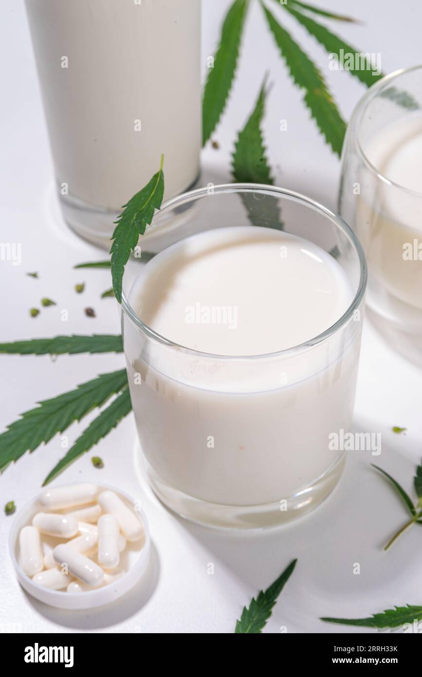 Cannabis milk. Non-dairy lactose free vegan milk from hemp seeds, on white background of ...