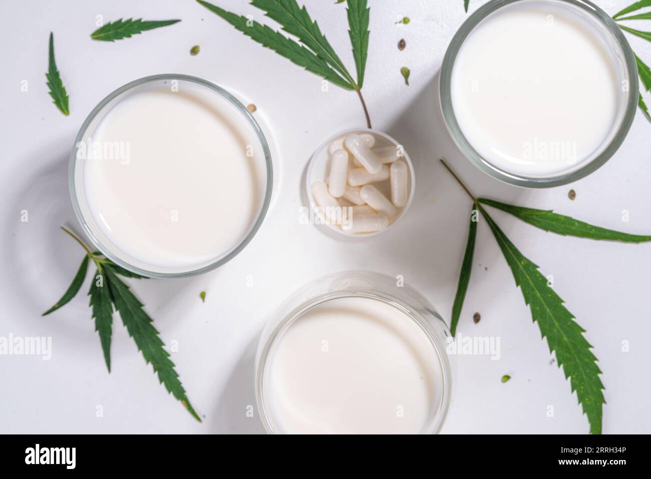 Cannabis milk. Non-dairy lactose free vegan milk from hemp seeds, on white background of ...