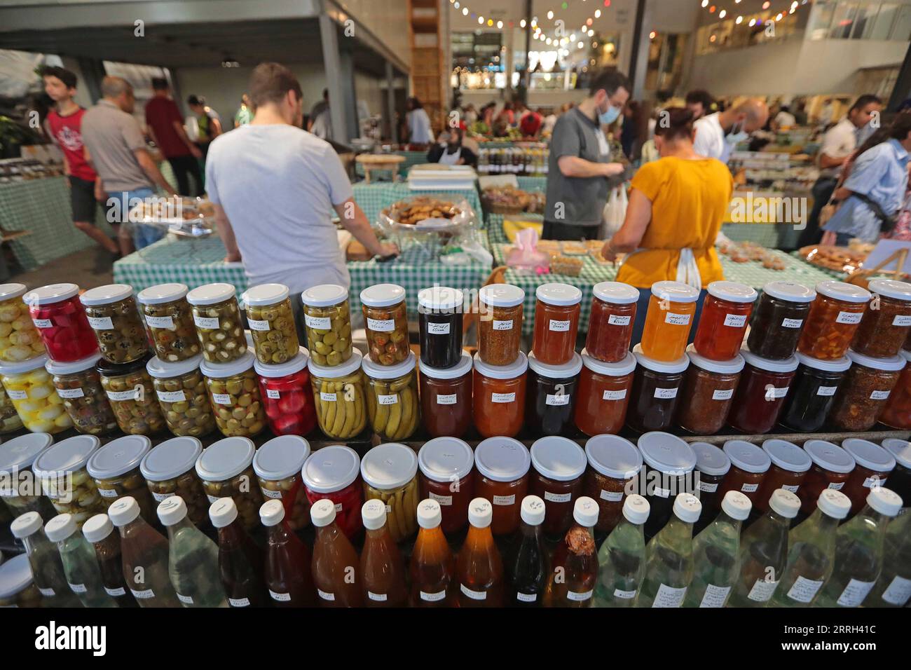 220612 -- BEIRUT, June 12, 2022 -- People shop at Souk El Tayeb, the ...
