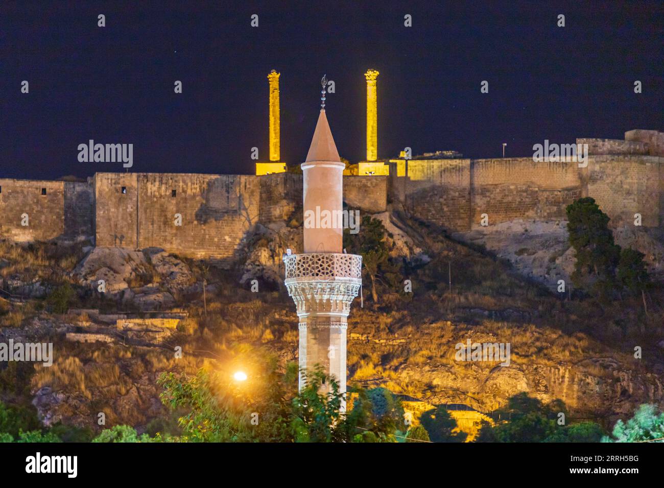 Night view of rizvaniye mosque in the front and Sanlıurfa castle in the ...