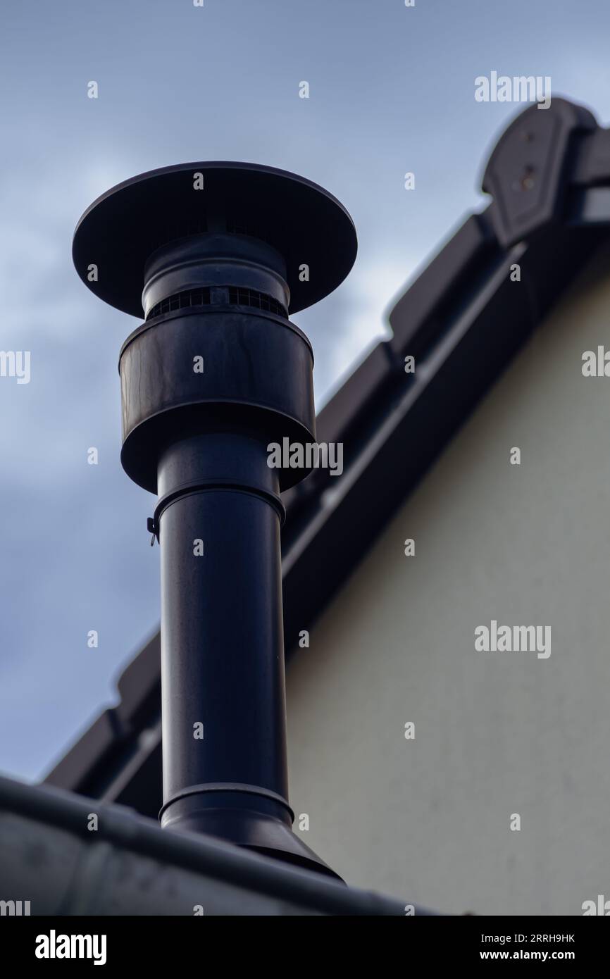 Chimney of a wood or pellet stove installed on the roof Stock Photo - Alamy
