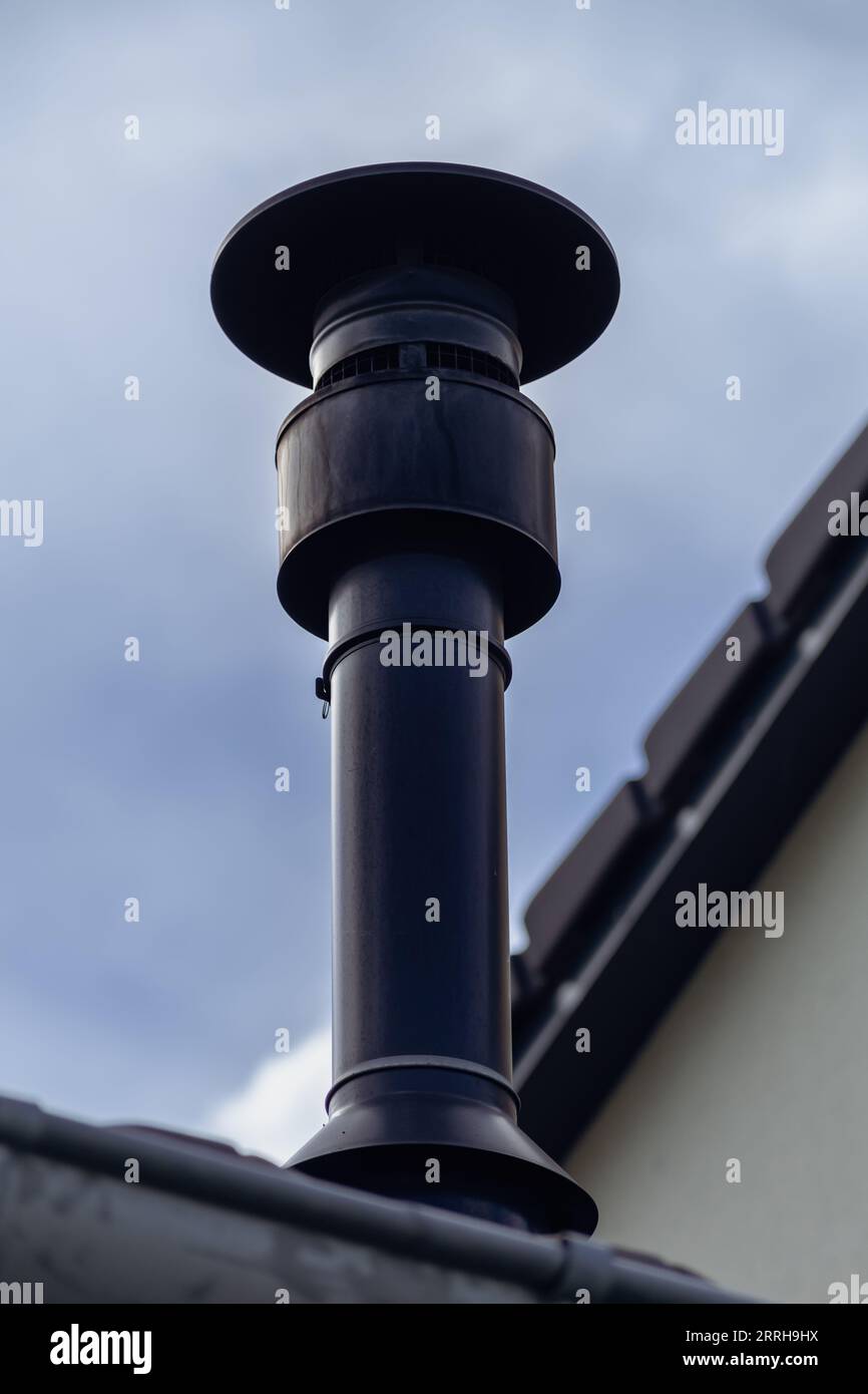 Chimney of a wood or pellet stove installed on the roof Stock Photo - Alamy