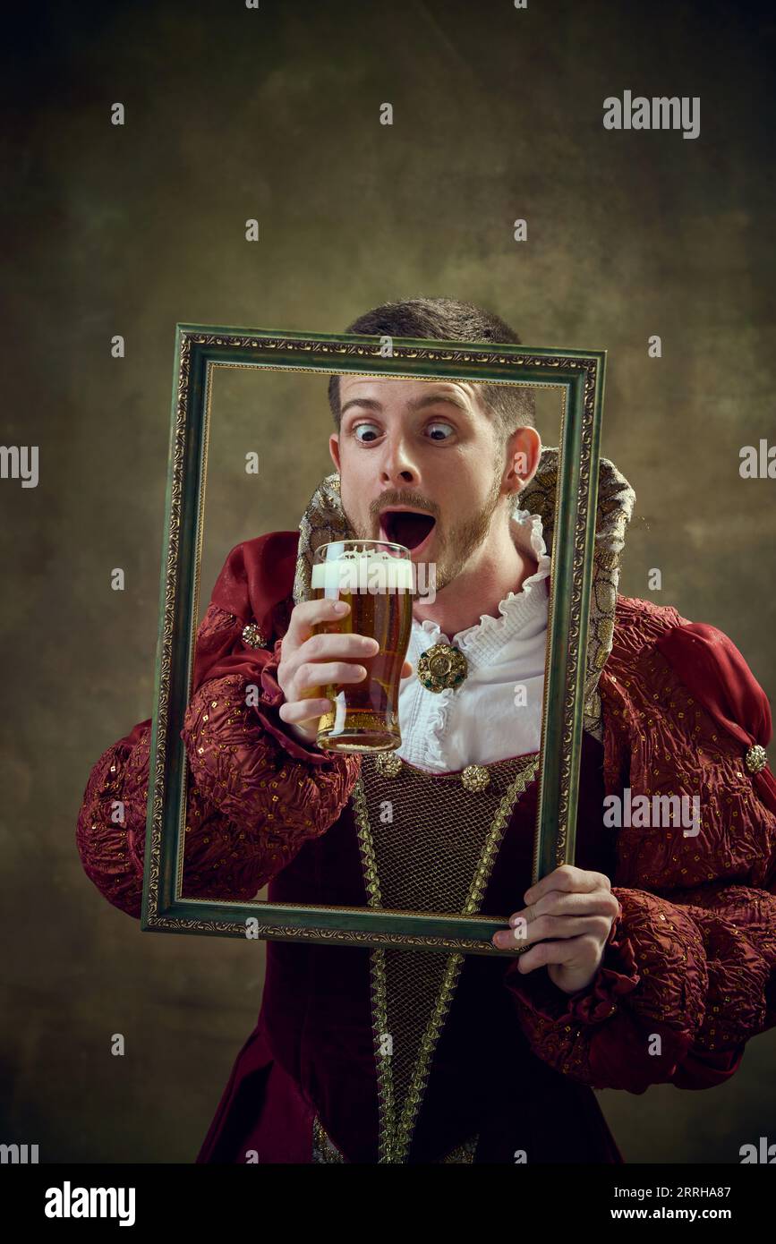 Medieval royal person, prince in female dress holding picture frame and ...