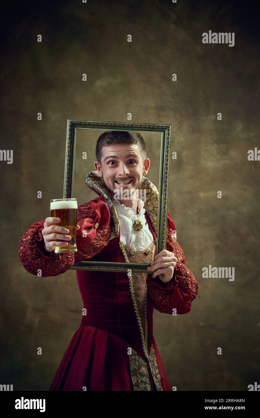 Medieval royal person, prince in female dress holding picture frame and ...