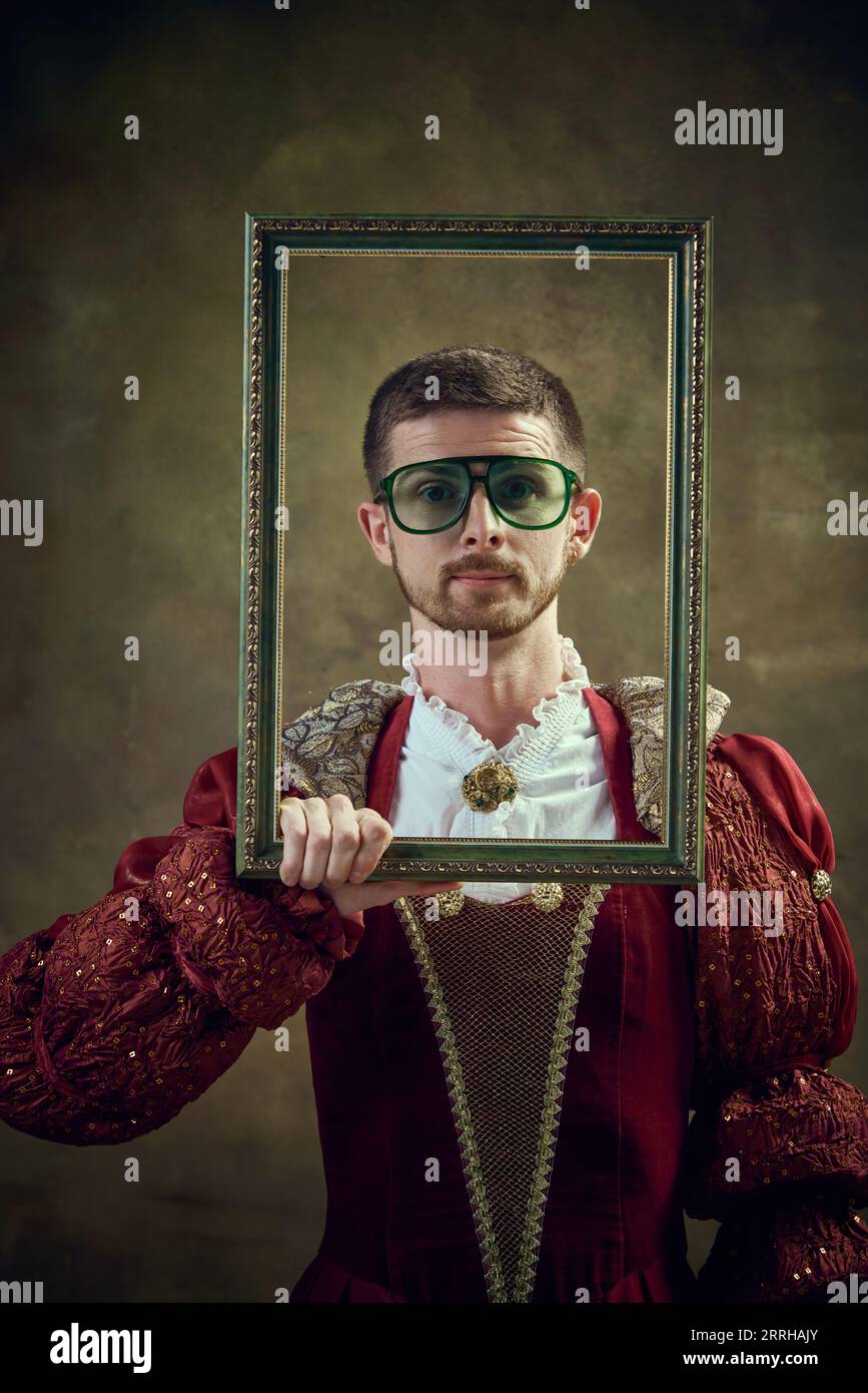 Portrait of medieval royal person, prince in female dress holding ...