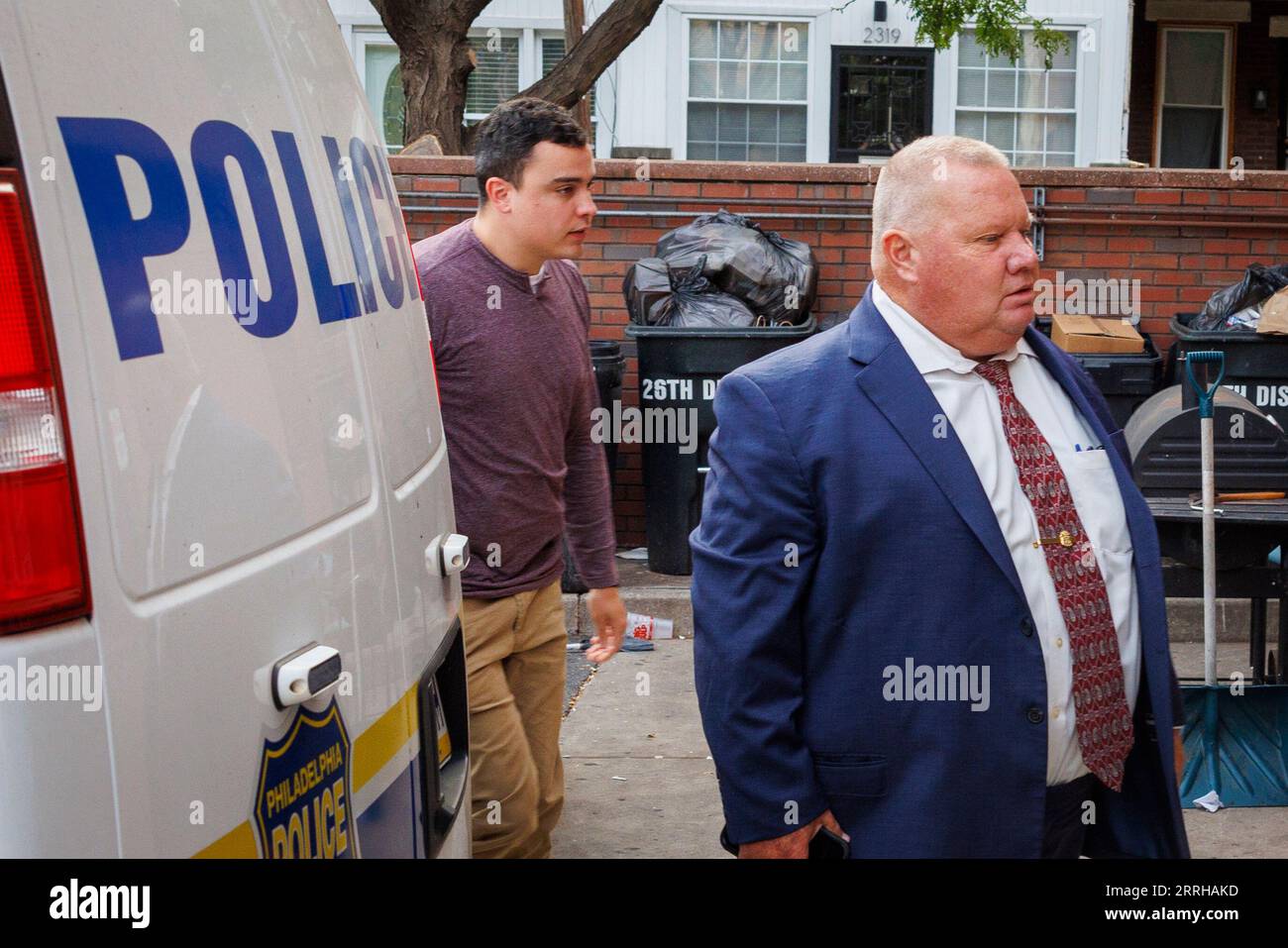 Philadelphia Police officer Mark Dial, left, enters the 1st District ...