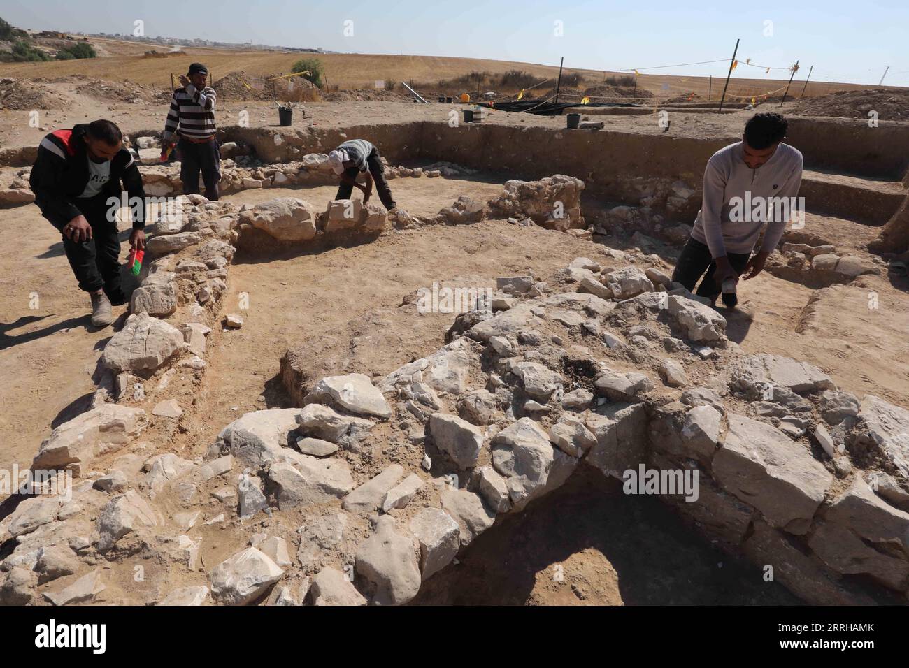 220623 -- RAHAT ISRAEL, June 23, 2022 -- People work around the relics ...
