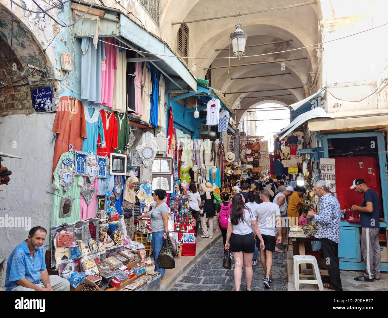 Tunis, Tunisia - 27 August, 2022: People walking in the medina quarter ...