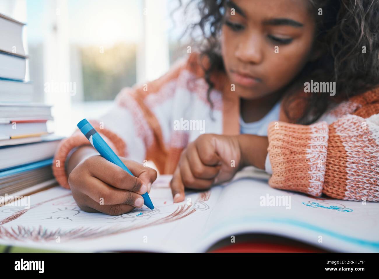 Education, homework and child coloring in a book for artistic project ...