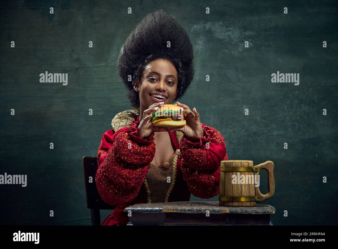 Beautiful african woman, medieval princess eating delicious burger ...