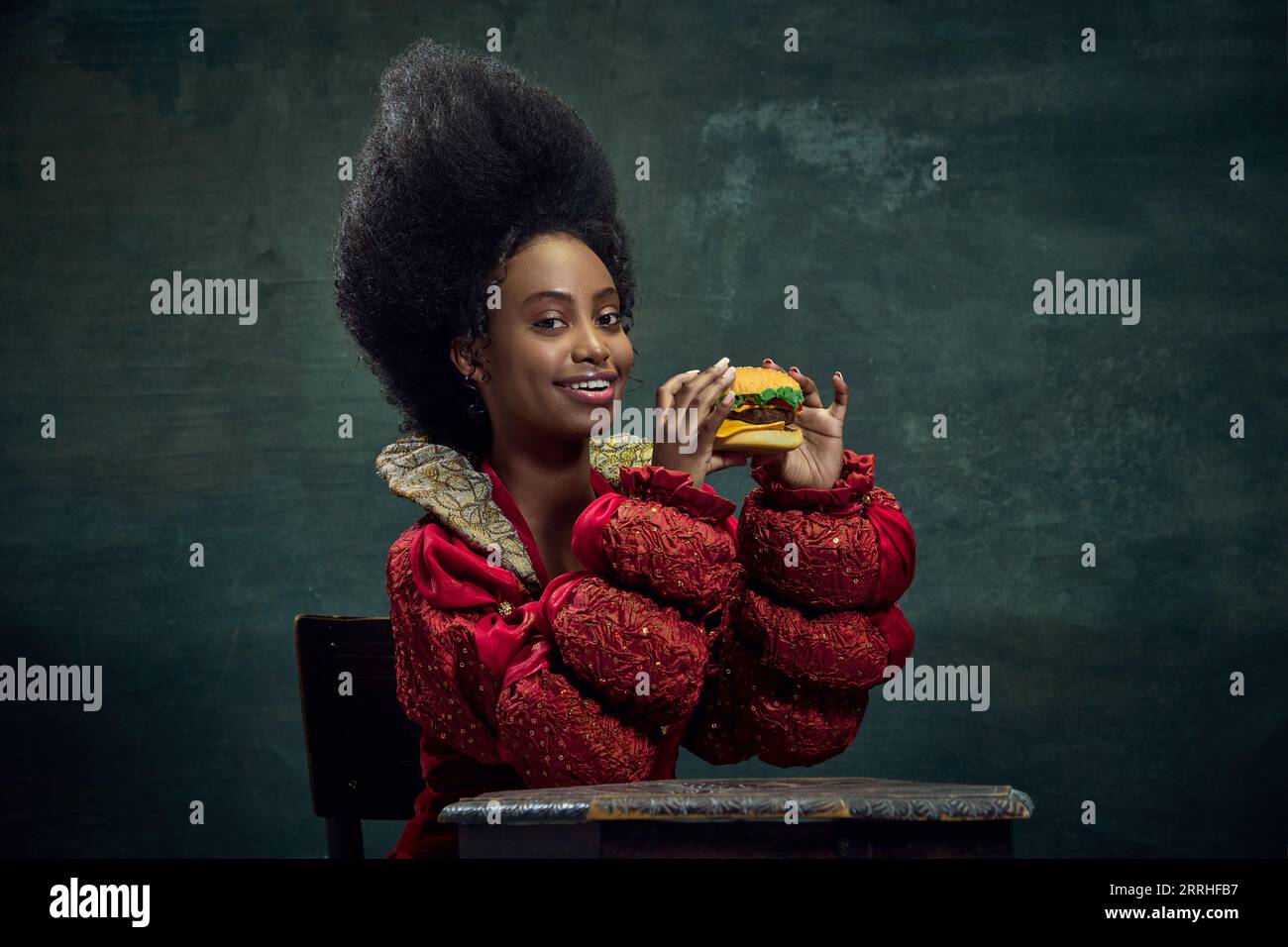 Beautiful african woman, medieval princess eating delicious burger ...