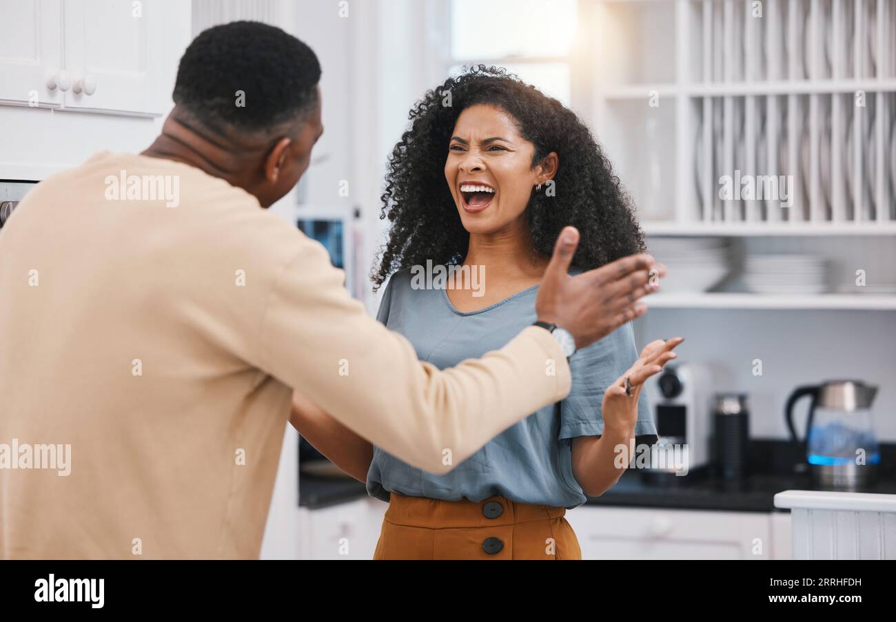 Divorce, stress and angry couple screaming in a kitchen for debt ...