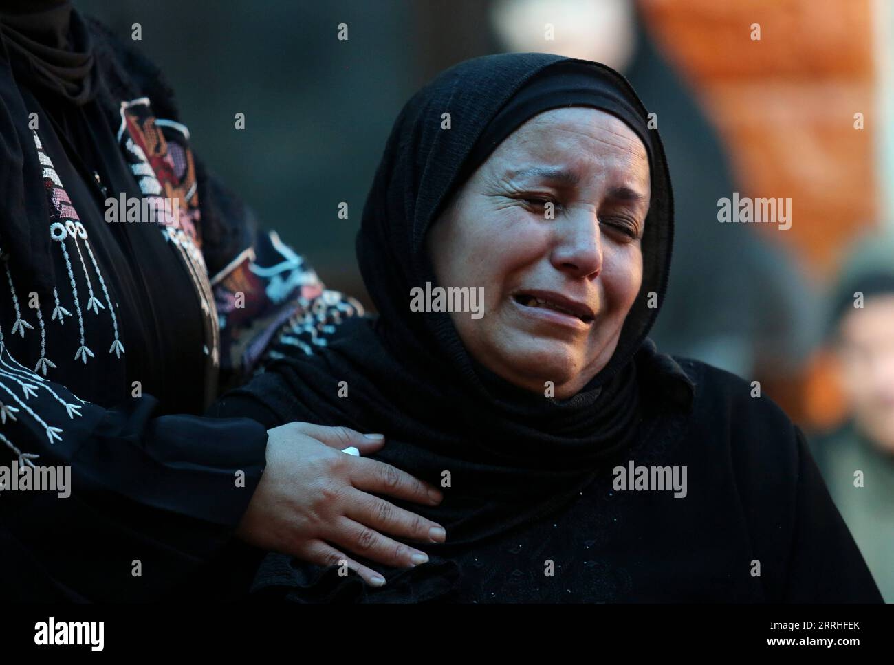 220629 -- JENIN, June 29, 2022 -- A woman mourns during the funeral of ...