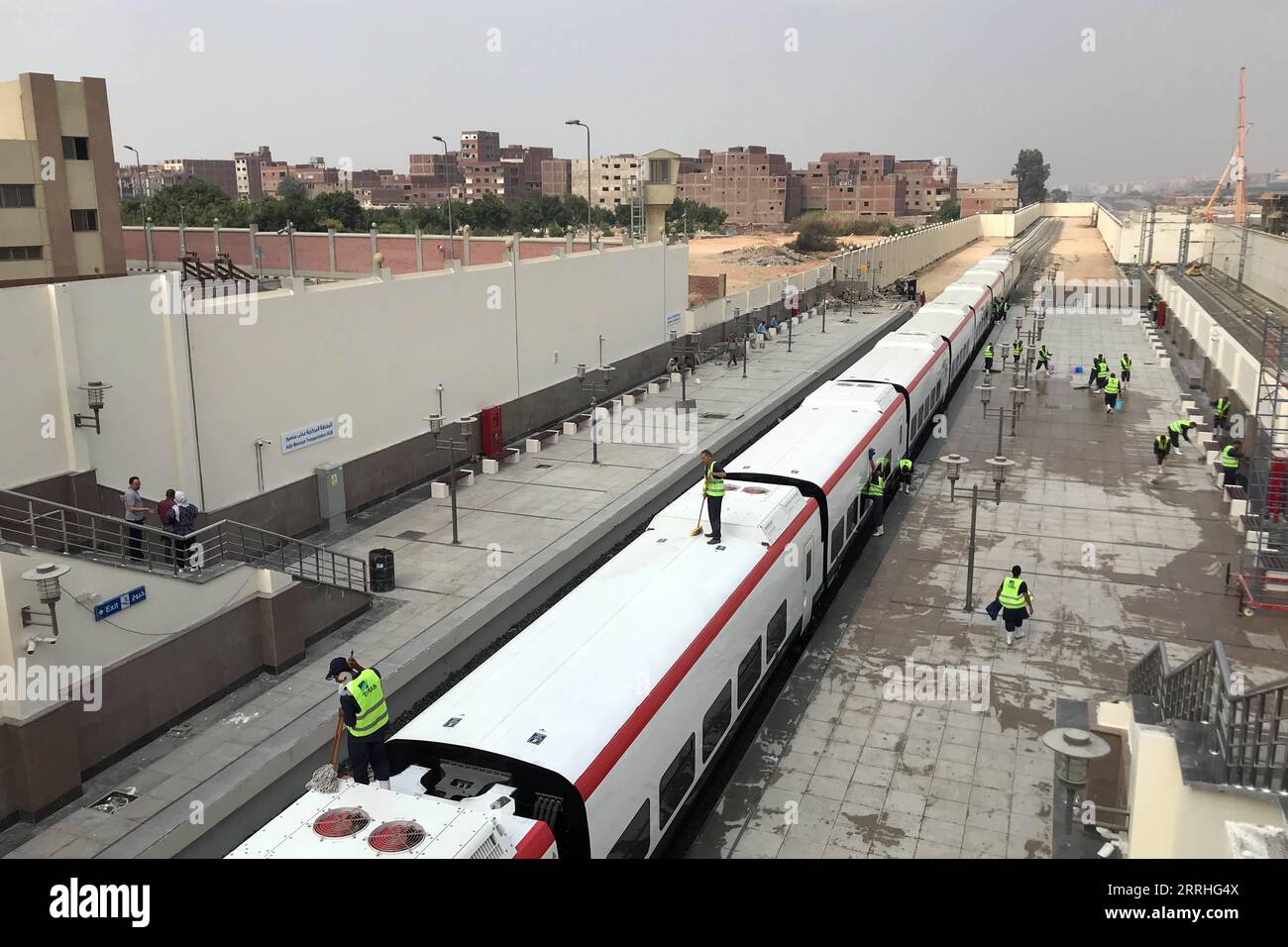 220630 -- CAIRO, June 30, 2022 -- Workers clean the Light Rail Transit ...