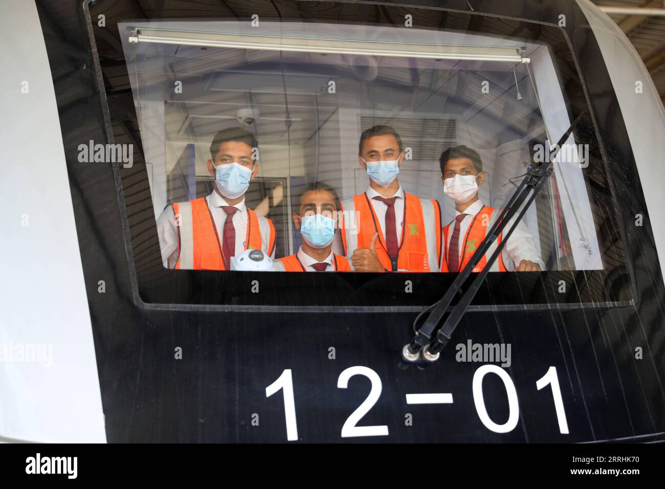 220703 -- CAIRO, July 3, 2022 -- Egyptian train drivers pose for photos ...