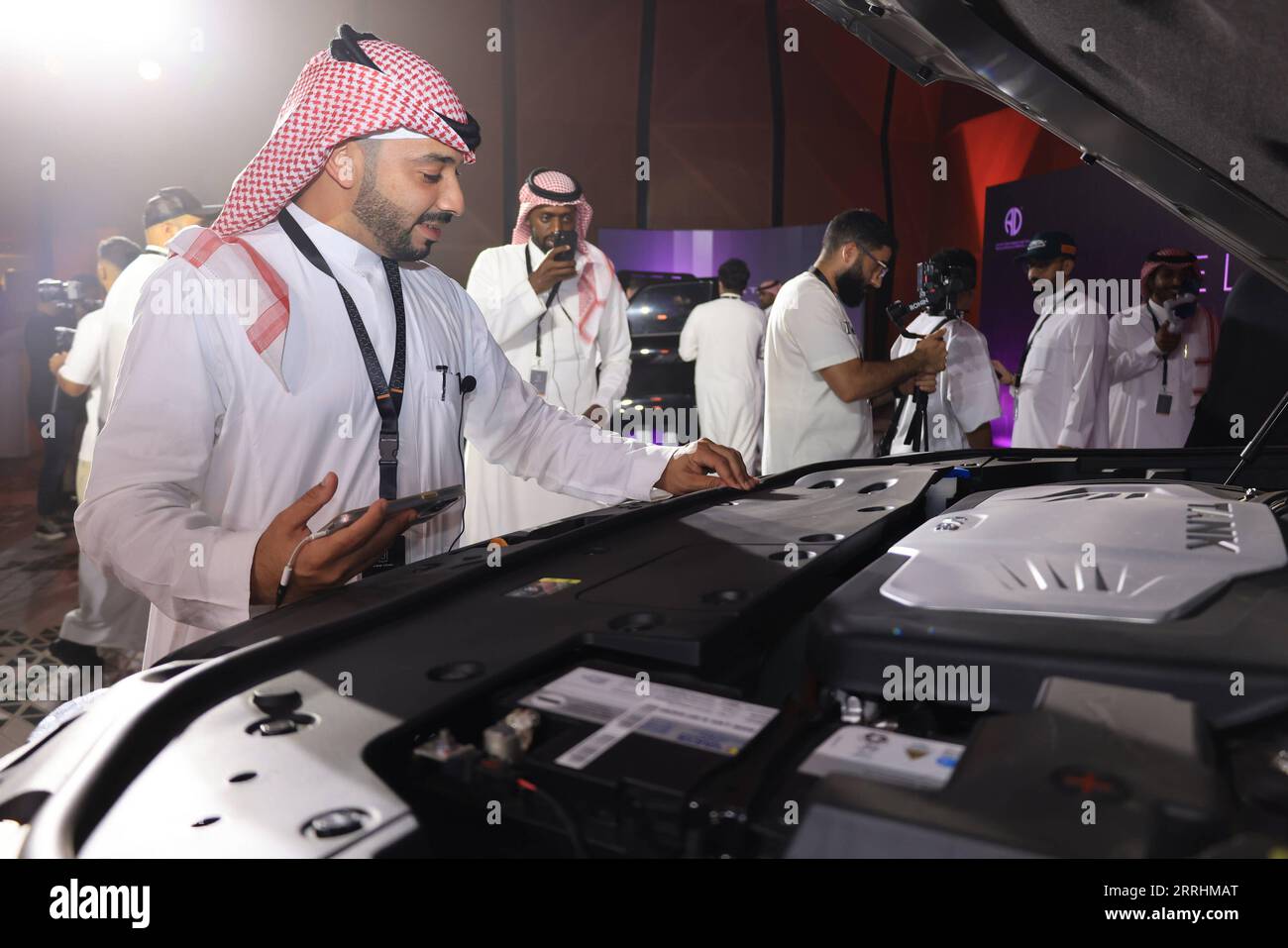 220704 -- RIYADH, July 4, 2022 -- People look at a off-road vehicle ...