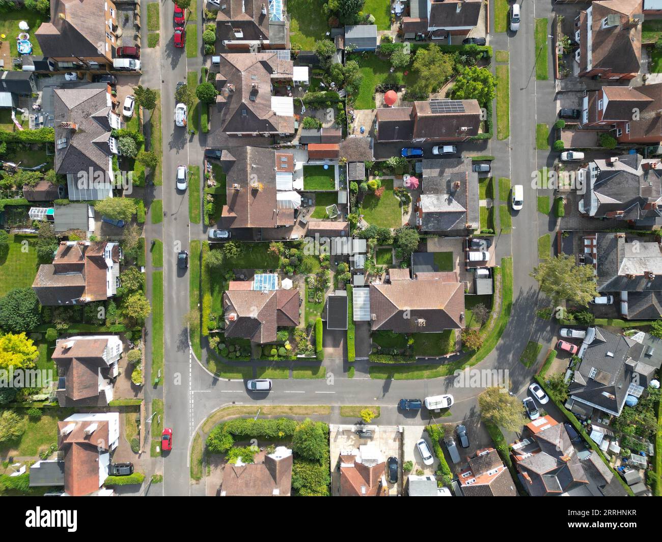 Aerial view of suburban housing with gardens and urban street layout in ...