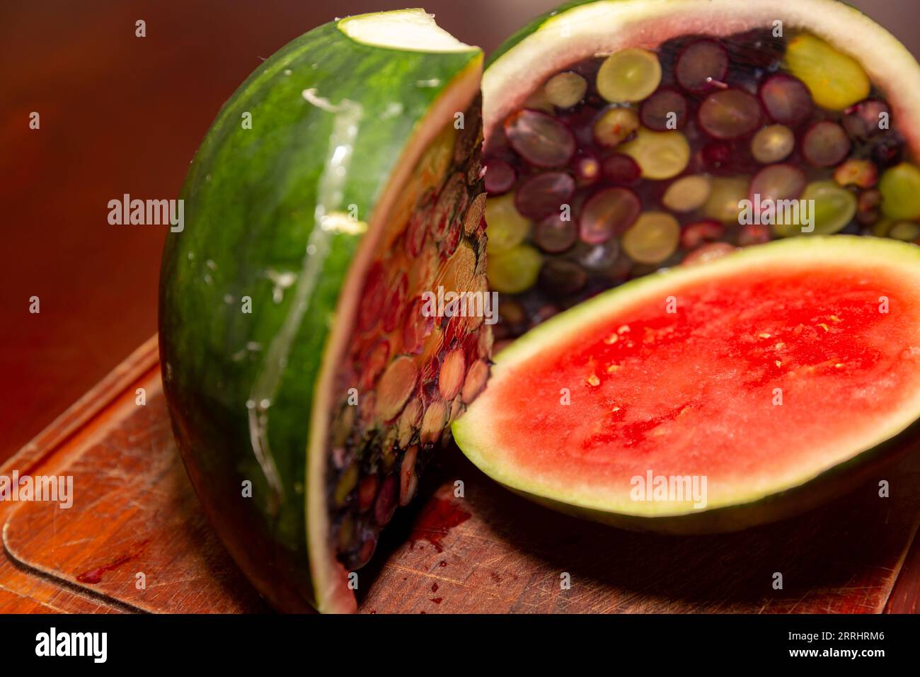 Opening a watermelon filled with gelatin and berries. Interesting and ...