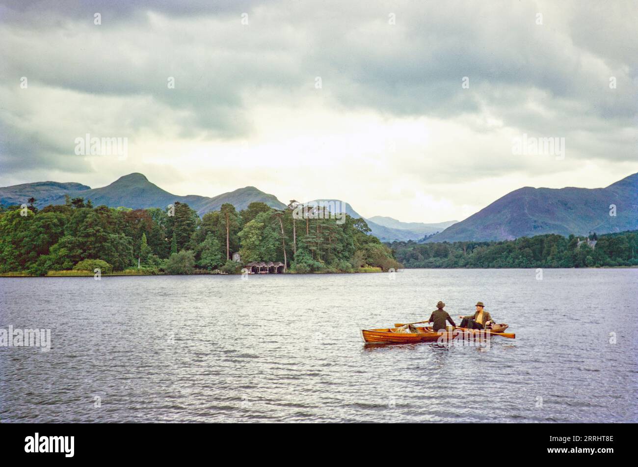 Row boat people rowing, Derwent Water, Lake District, England, 1963 ...
