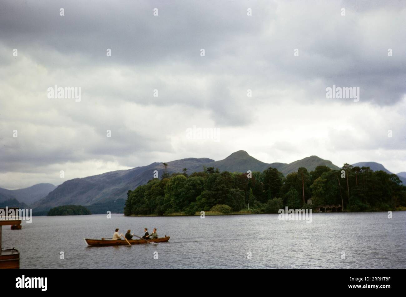 Row boat people rowing, Derwent Water, Lake District, England, 1963 ...