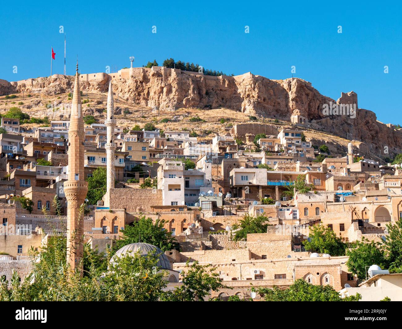 Cityscape of the old city of Mardin, Turkey featuring a hill ...