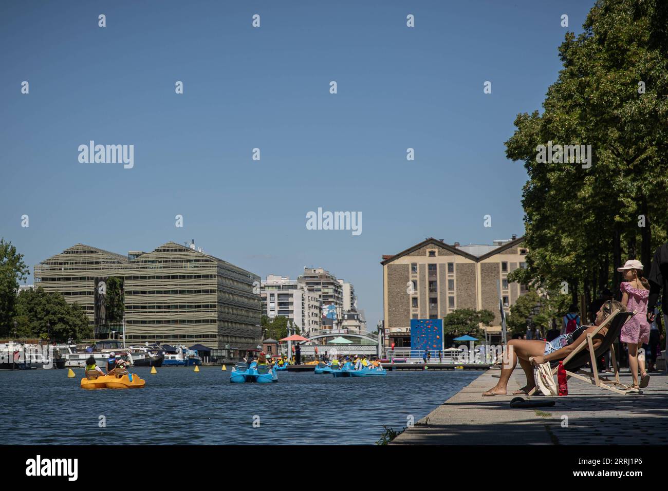 220712 -- PARIS, July 12, 2022 -- People enjoy the annual Paris Plages ...