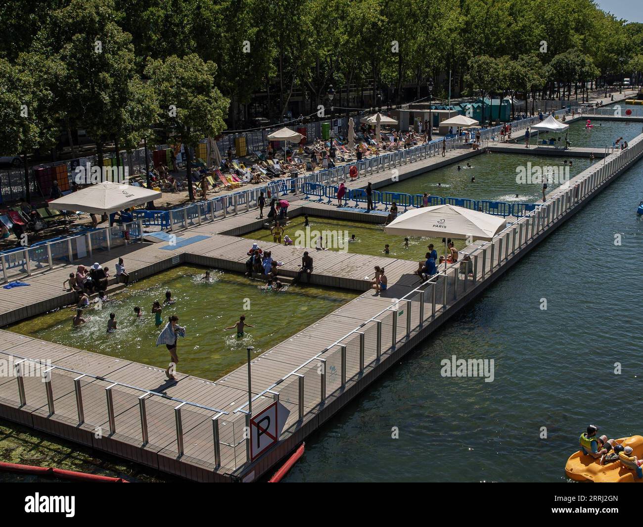 220712 -- PARIS, July 12, 2022 -- People enjoy the annual Paris Plages ...