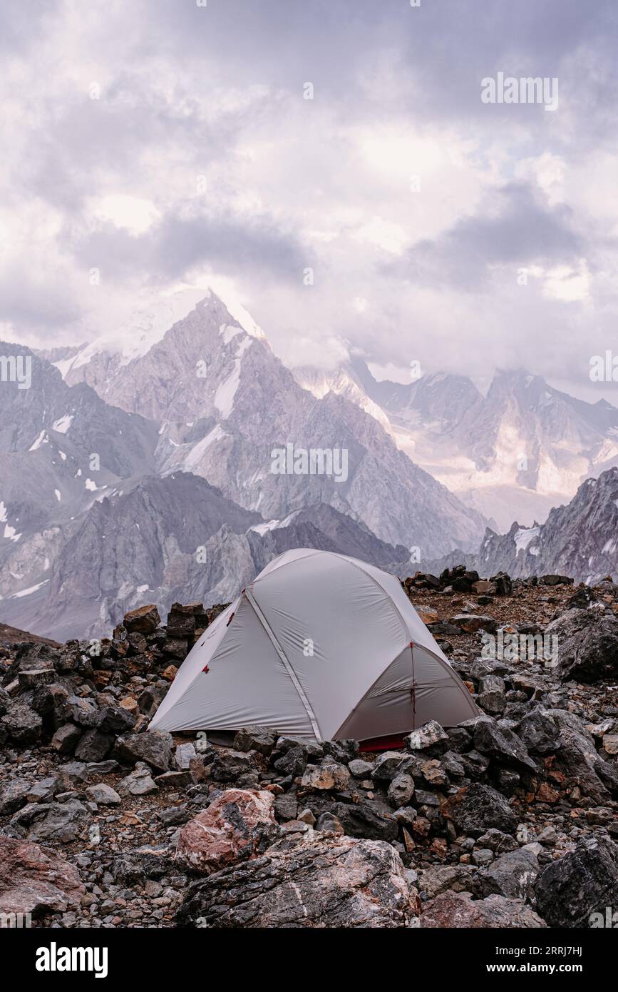 Camping high in the mountains in a tent Stock Photo - Alamy