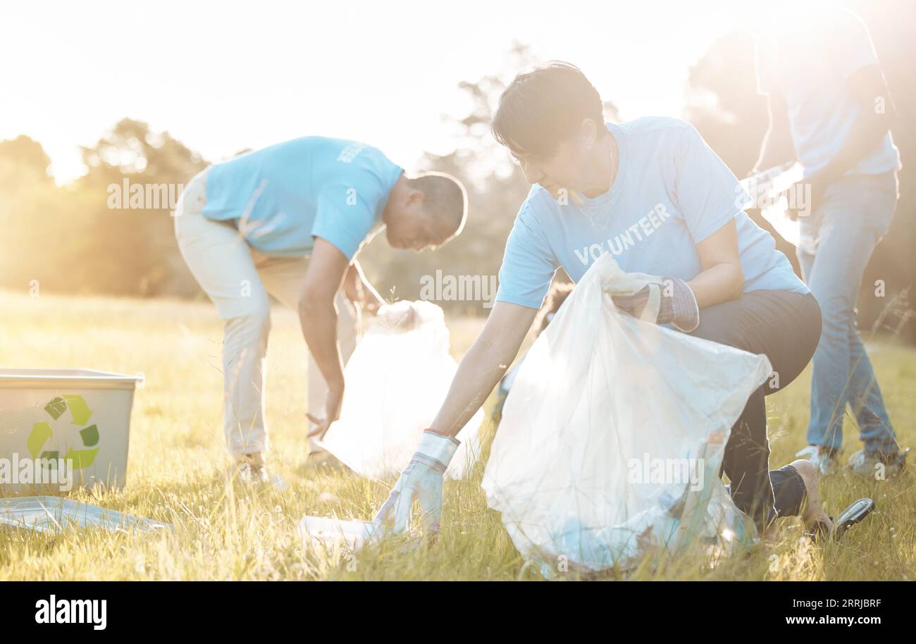Nature recycling, community service volunteer and woman cleaning ...
