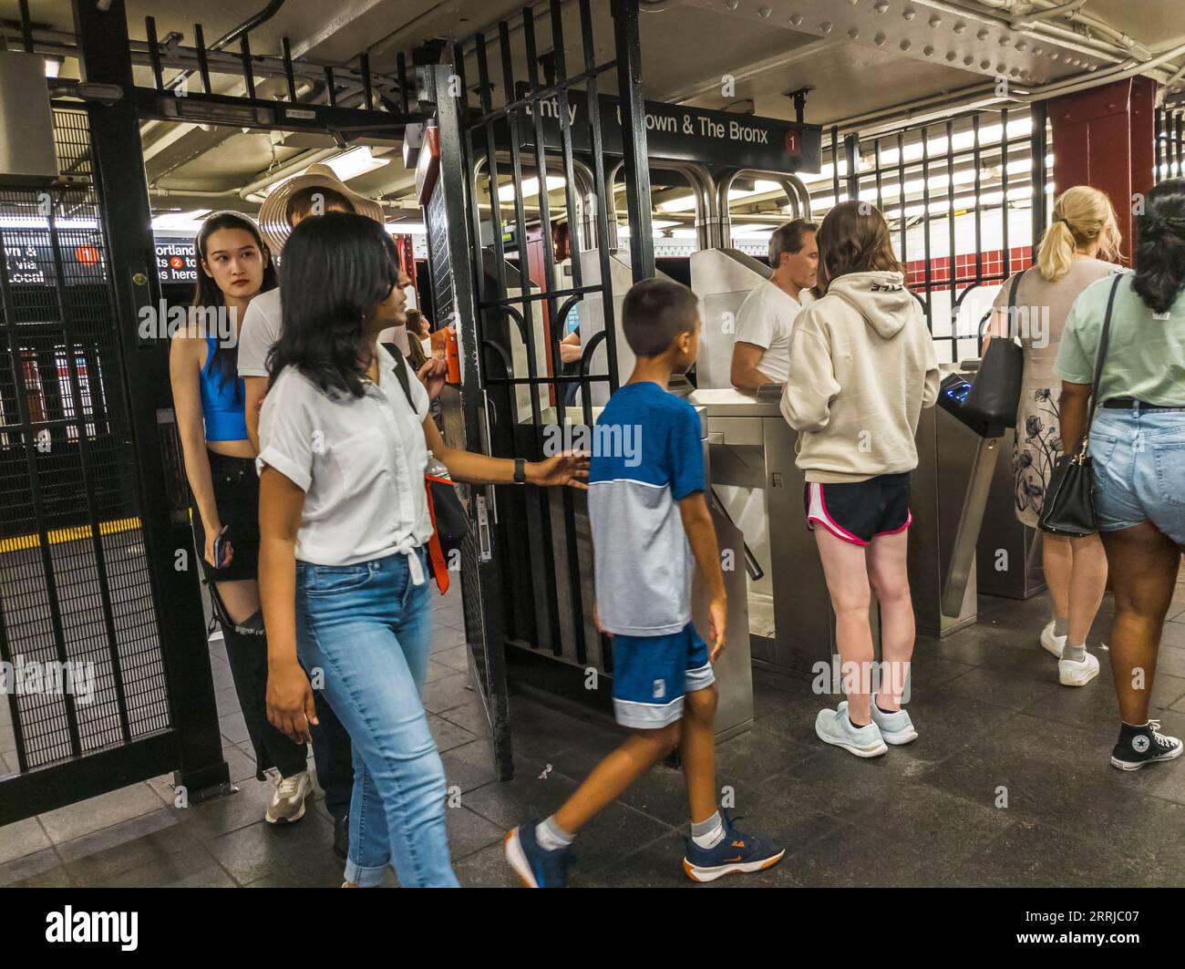 Weekend riders enter and exit the West 28th St. station in the New York ...