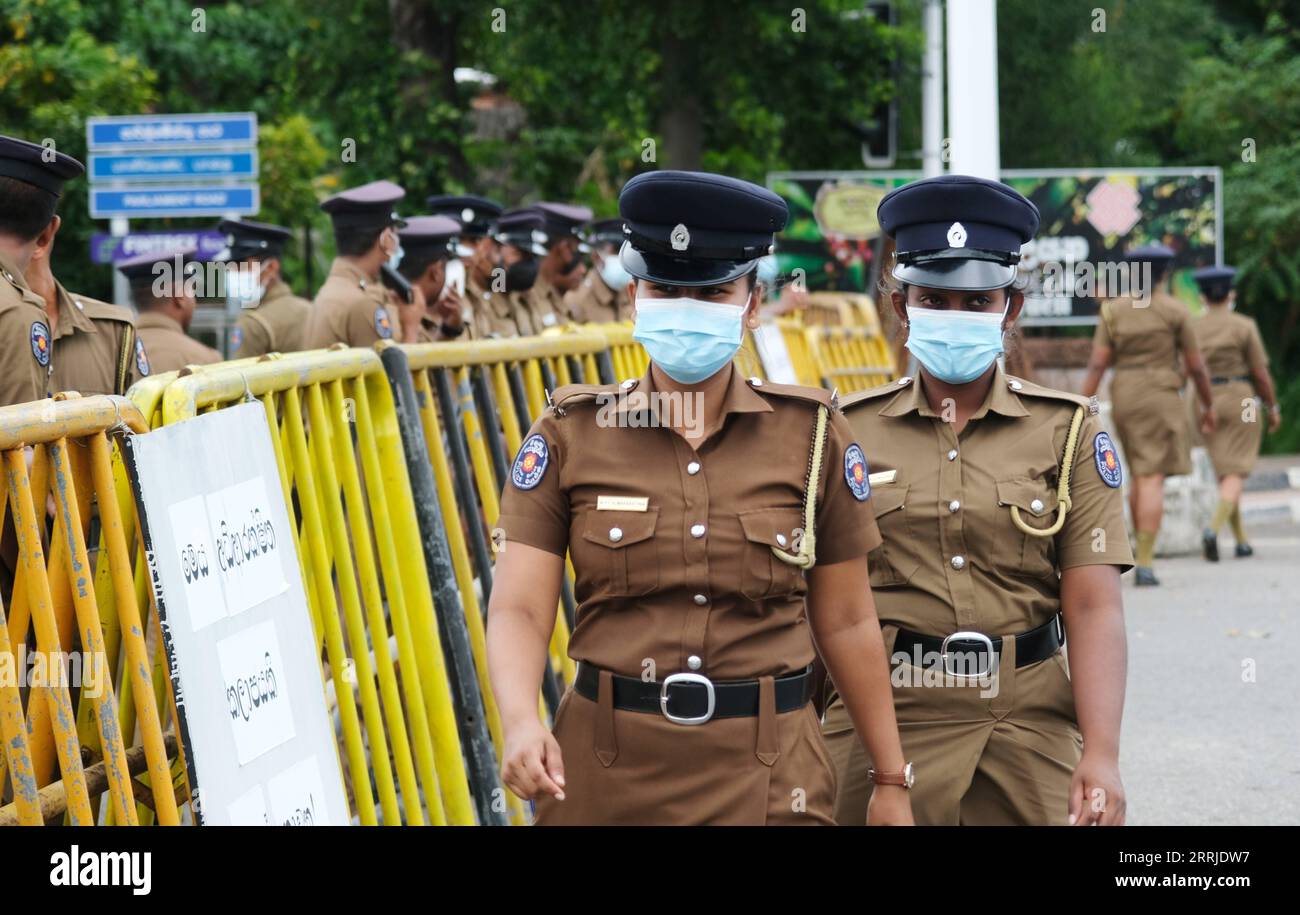220720 -- COLOMBO, July 20, 2022 -- Military and police officers stand ...