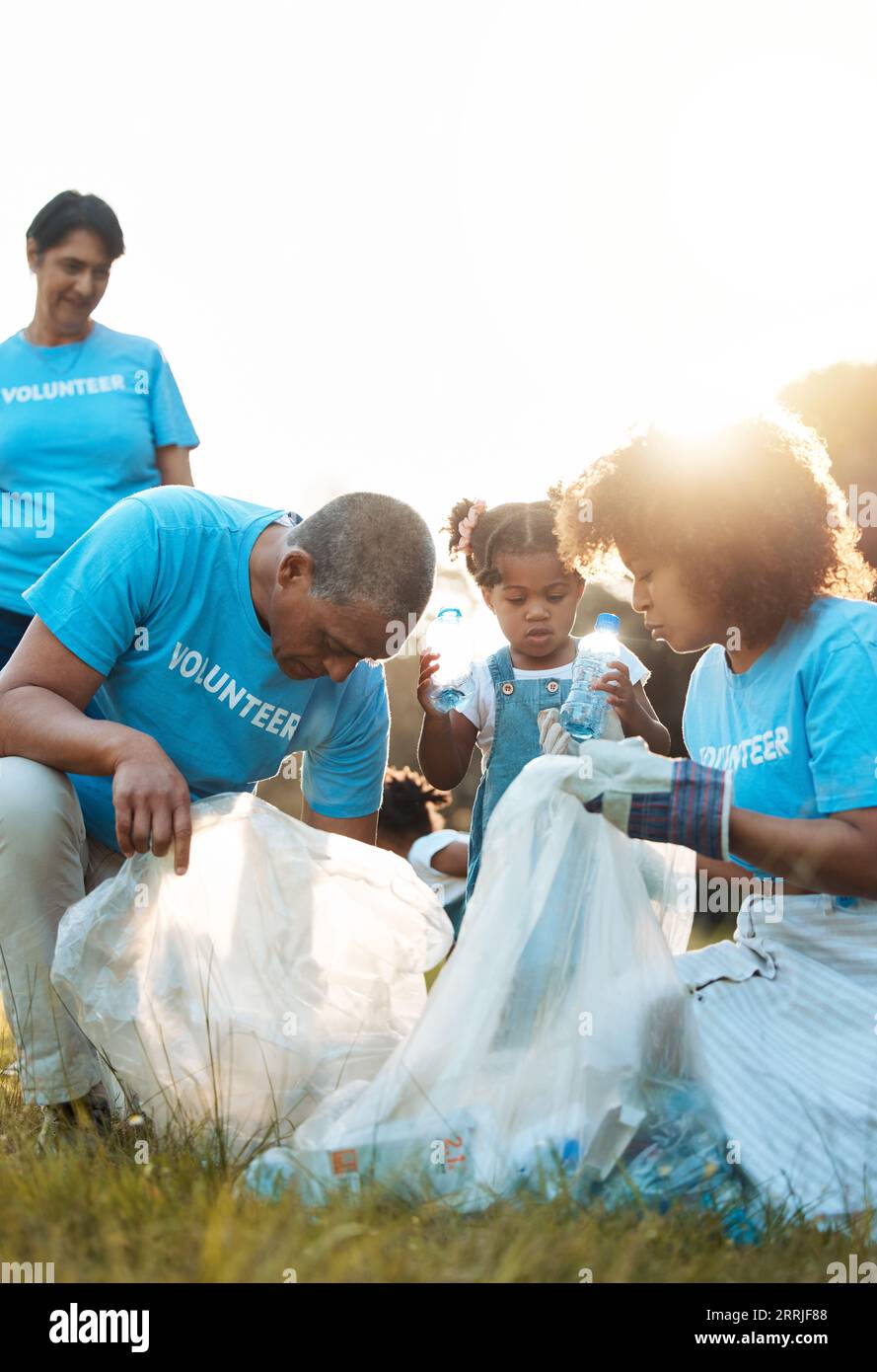 Nature activist, volunteering and family cleaning garbage pollution ...