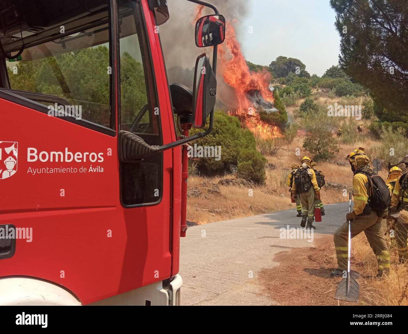 220721 -- CEBREROS SPAIN, July 21, 2022 -- Firefighters work near a ...