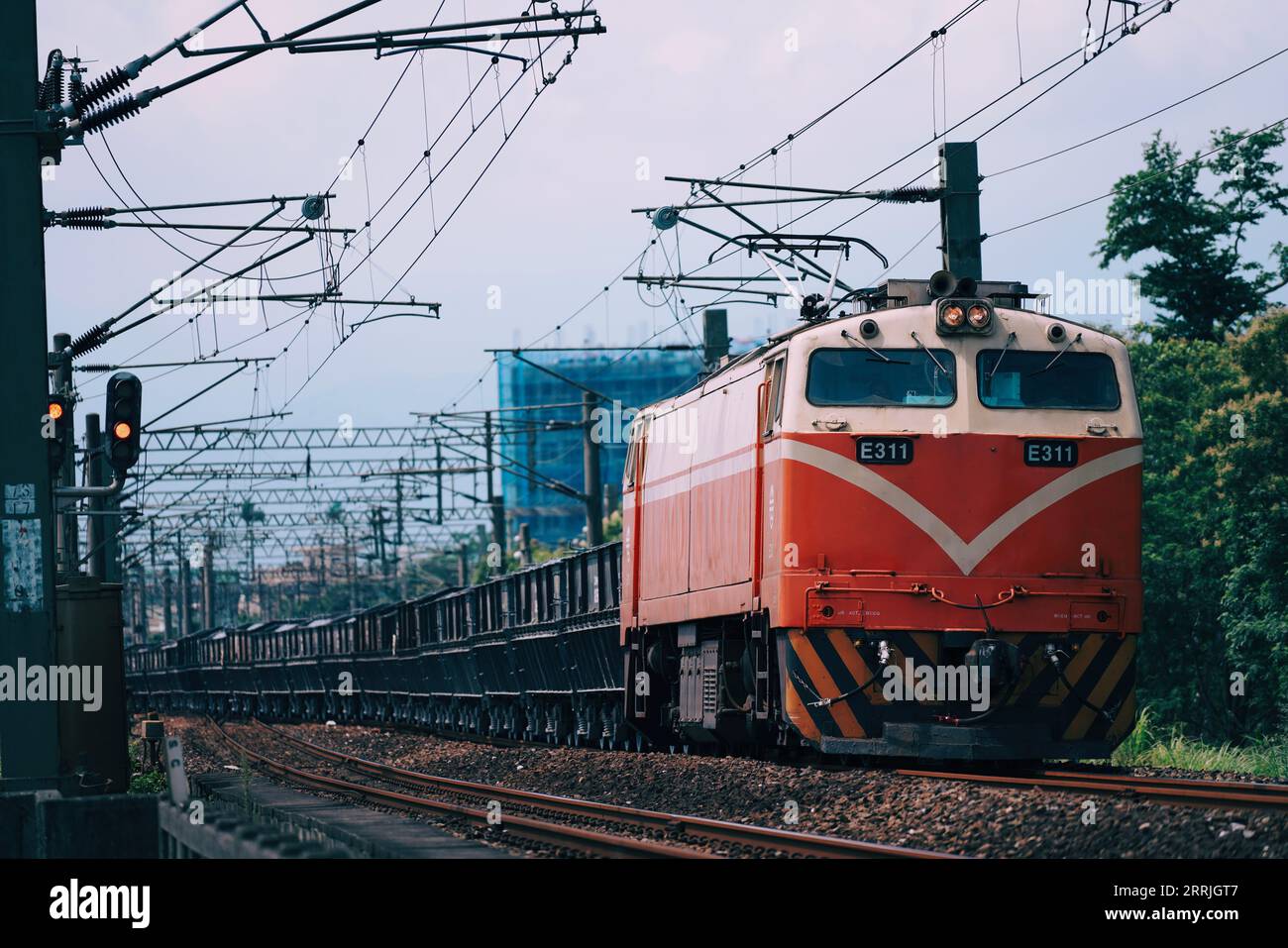 A modern electric train is pictured on a set of train tracks ...