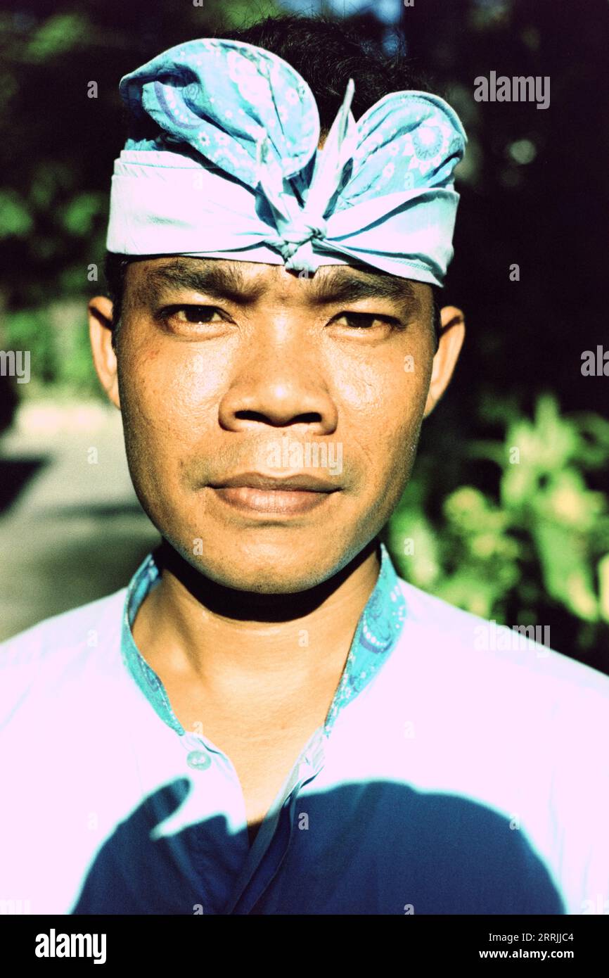 Stunning portrait of a local Balinese man in traditional clothing going ...