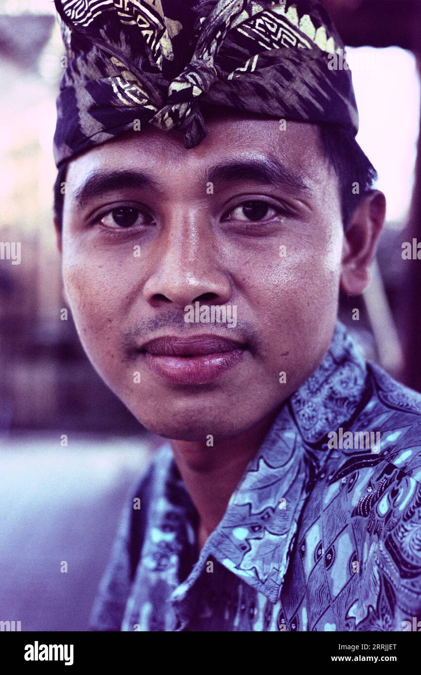 Stunning portrait of a local Balinese man in traditional clothing going ...