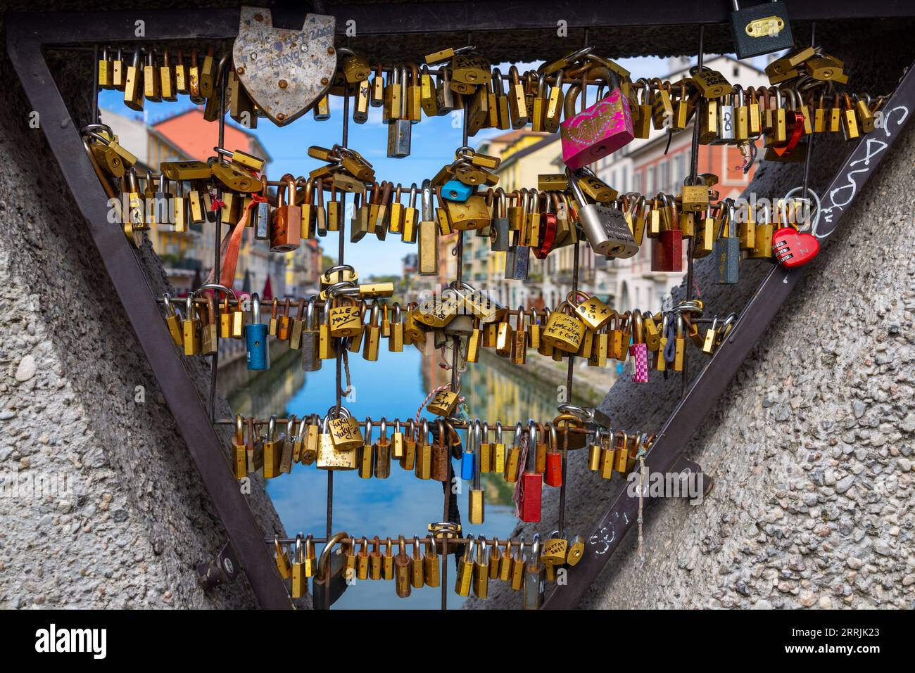 Love locks on a bridge over a river in the Navigli complex, Milan ...