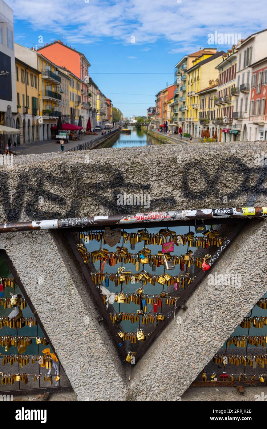 Love locks on a bridge over a river in the Navigli district, Milan ...