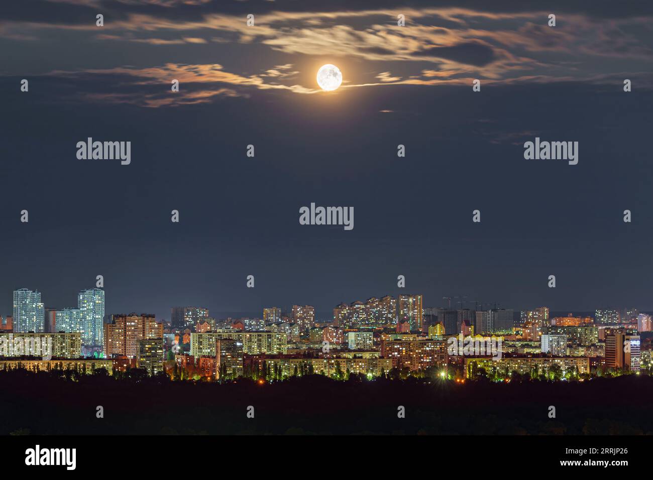 Full Moon over the night city. Night cityscape Stock Photo - Alamy