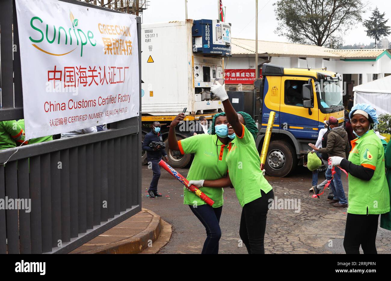 220802 -- KIAMBU, Aug. 2, 2022 -- Staff members celebrate the departure ...