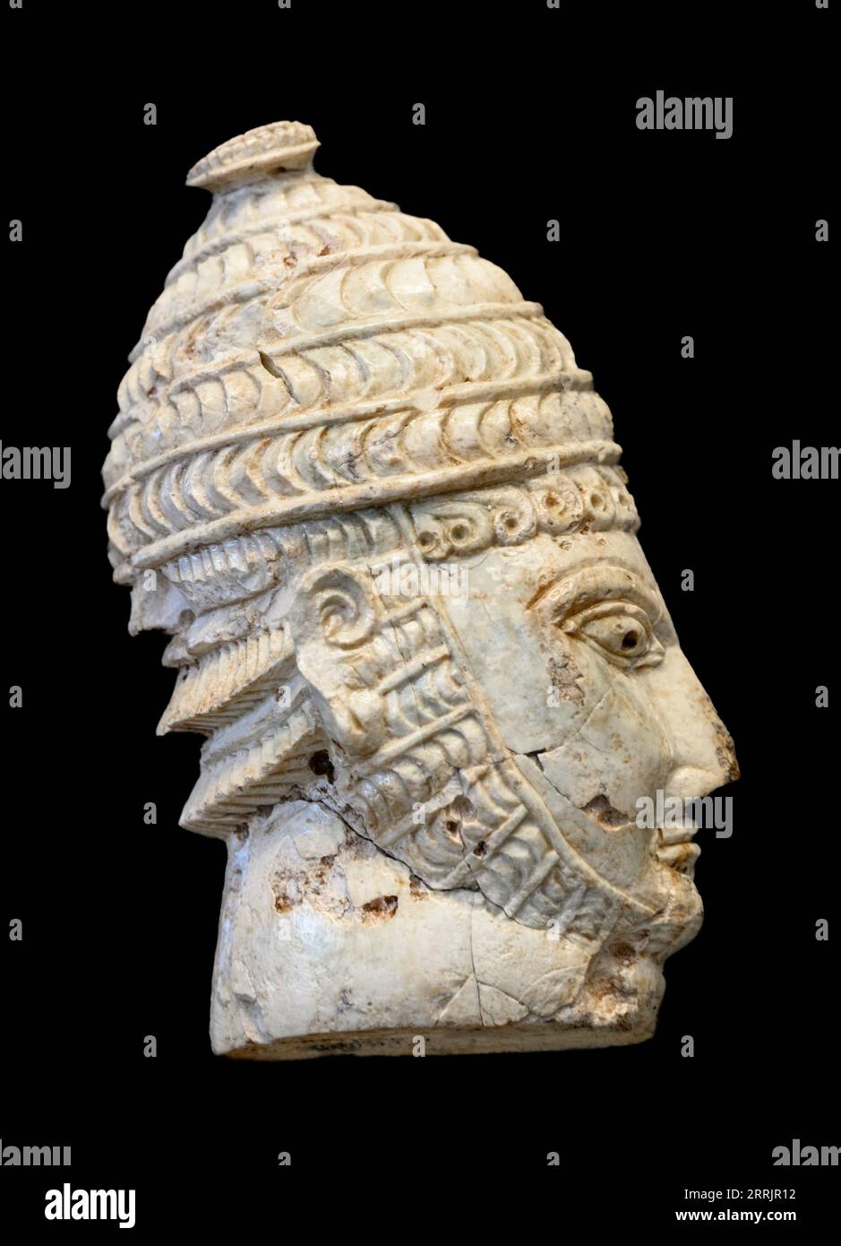 Mycenaean, Ivory, warriors head wearing a boars tusk helmet. 14th–13th century BC. from the tomb ...