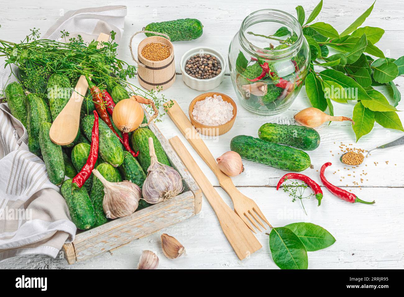 Preserved season vegetable concept. Harvest of cucumber, chili, greens ...