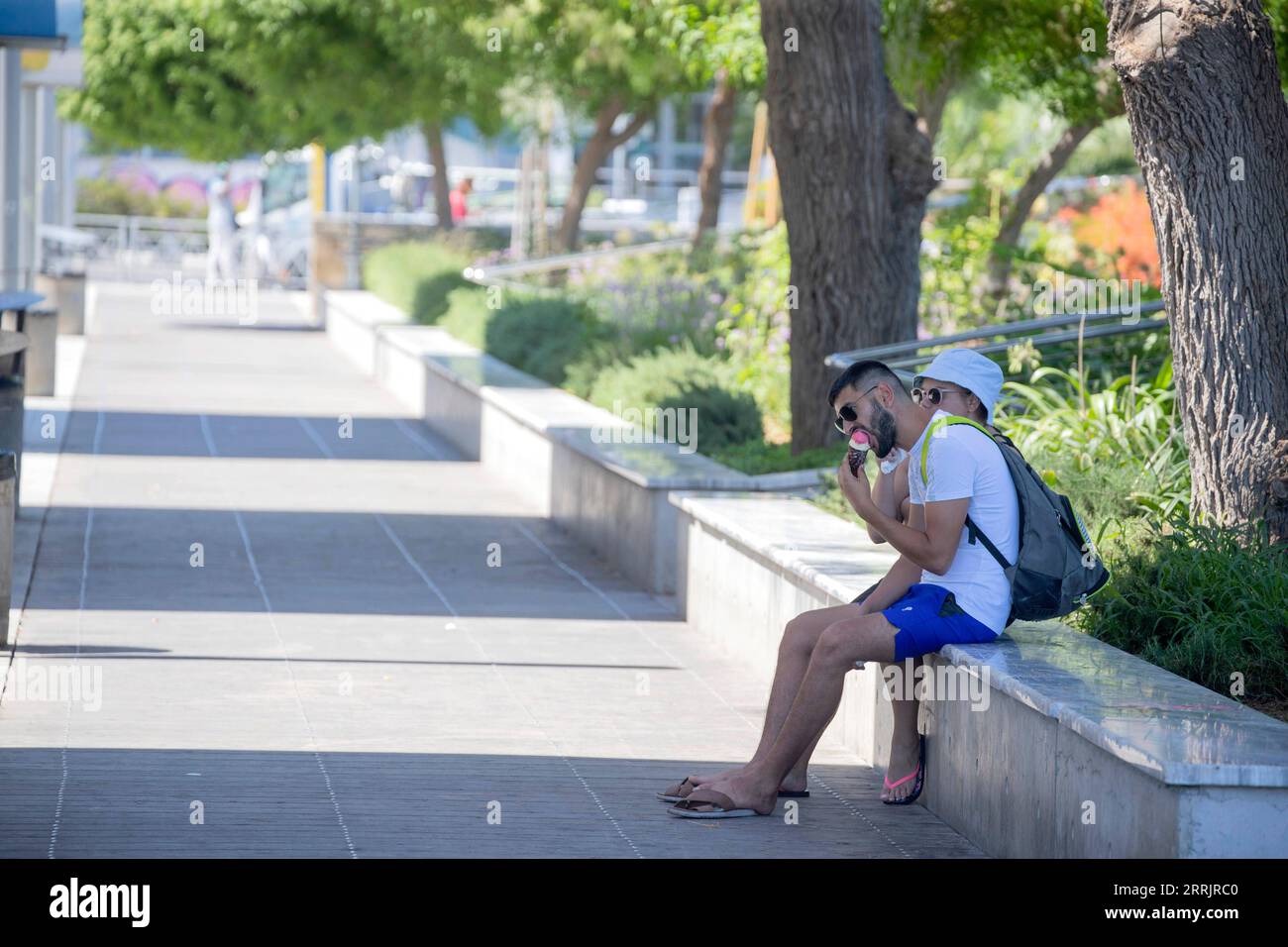 Man in yellow eats on hi-res stock photography and images - Alamy