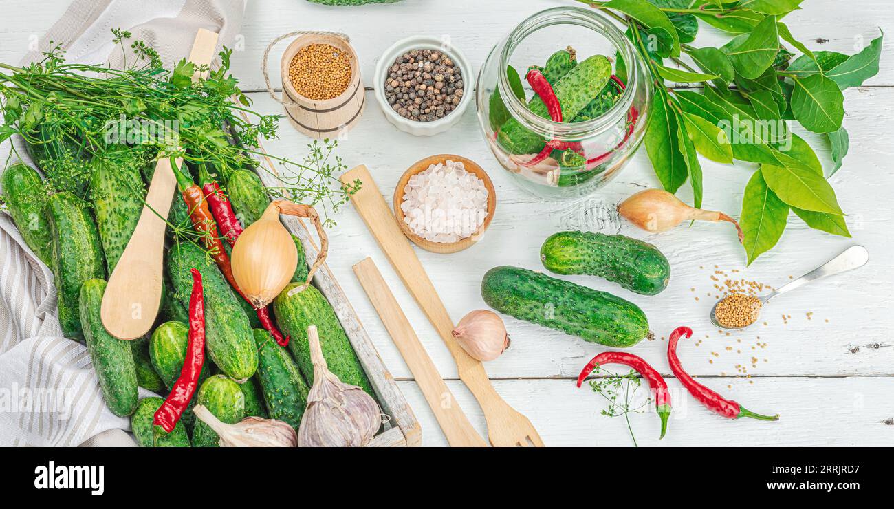 Preserved season vegetable concept. Harvest of cucumber, chili, greens ...
