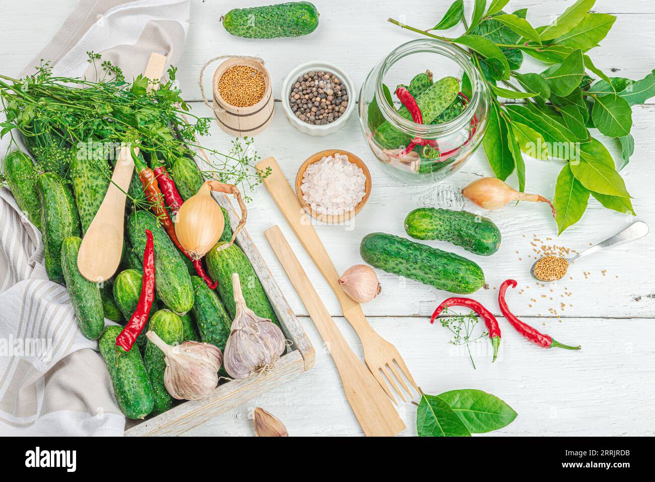 Preserved season vegetable concept. Harvest of cucumber, chili, greens ...