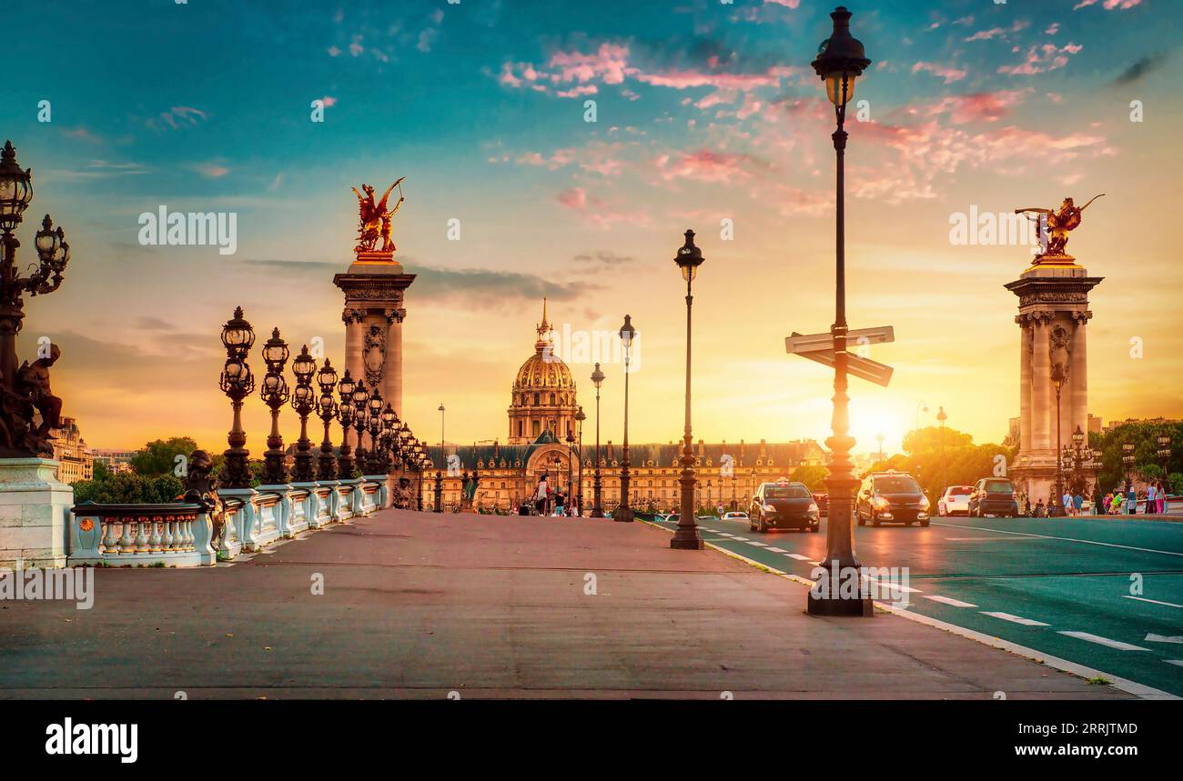 Les Invalides quarter and Alexandre III bridge in Paris at sunset Stock ...