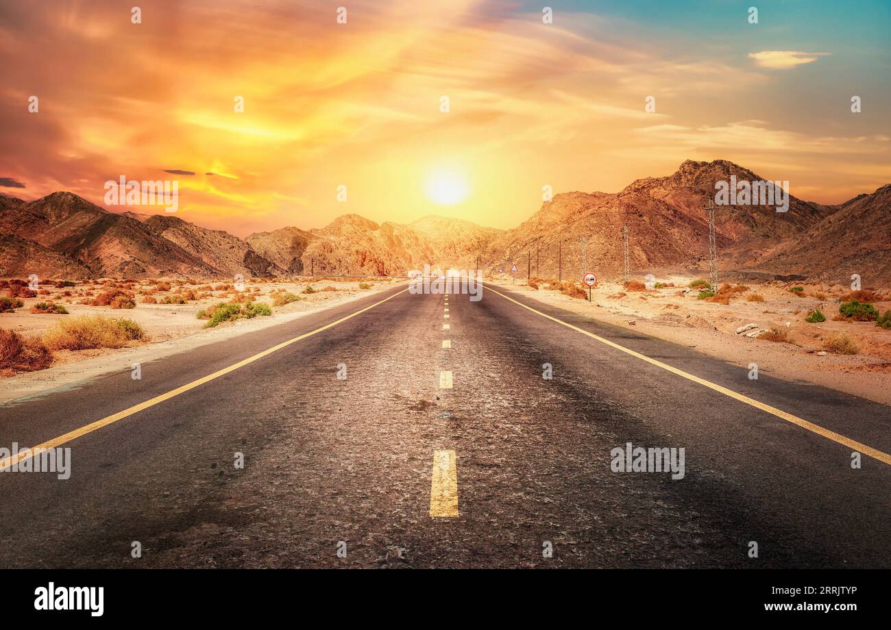 Morning sun over road in desert of Egypt Stock Photo - Alamy