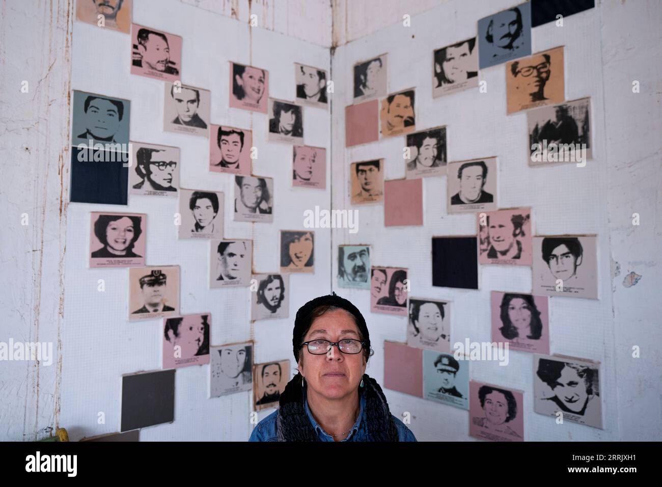 Yelena Monroy poses for portrait by photos of detainees who disappeared ...