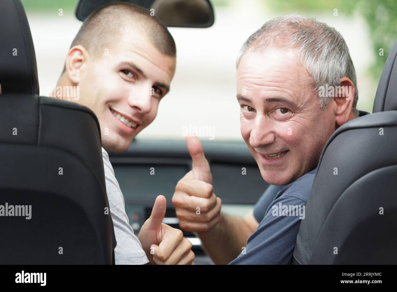 father teaching his son how to drive Stock Photo - Alamy