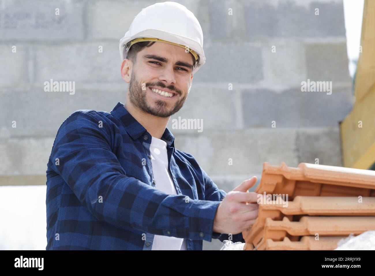 Placing tiles hi-res stock photography and images - Alamy